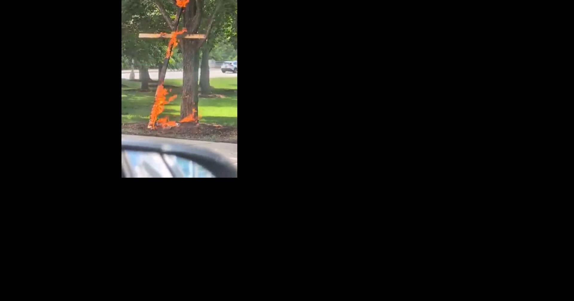 Police are investigating a large burning cross at a Chicago park ...