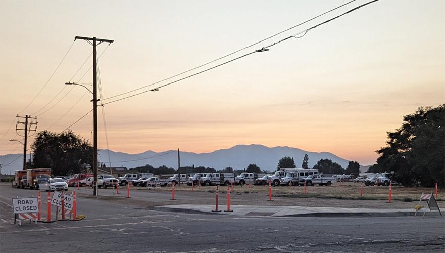 Firefighters gaining on two large wildfires as THS campus becomes a ...
