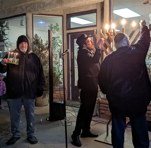 Sixth night of Hanukkah celebrated with menorah lighting downtown ...