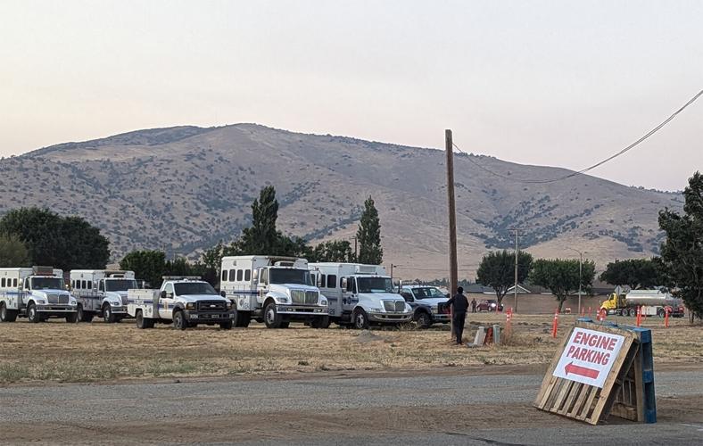 Firefighters gaining on two large wildfires as THS campus becomes a ...