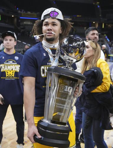 College basketball: Donaldson helps No. 22 Michigan rally late again to ...