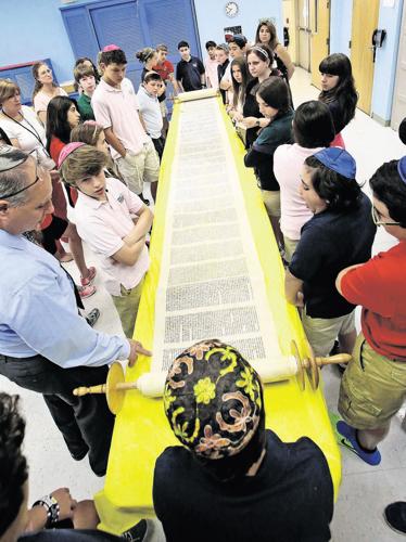 Female Jewish scribe painstakingly repairs the Torah | Features ...