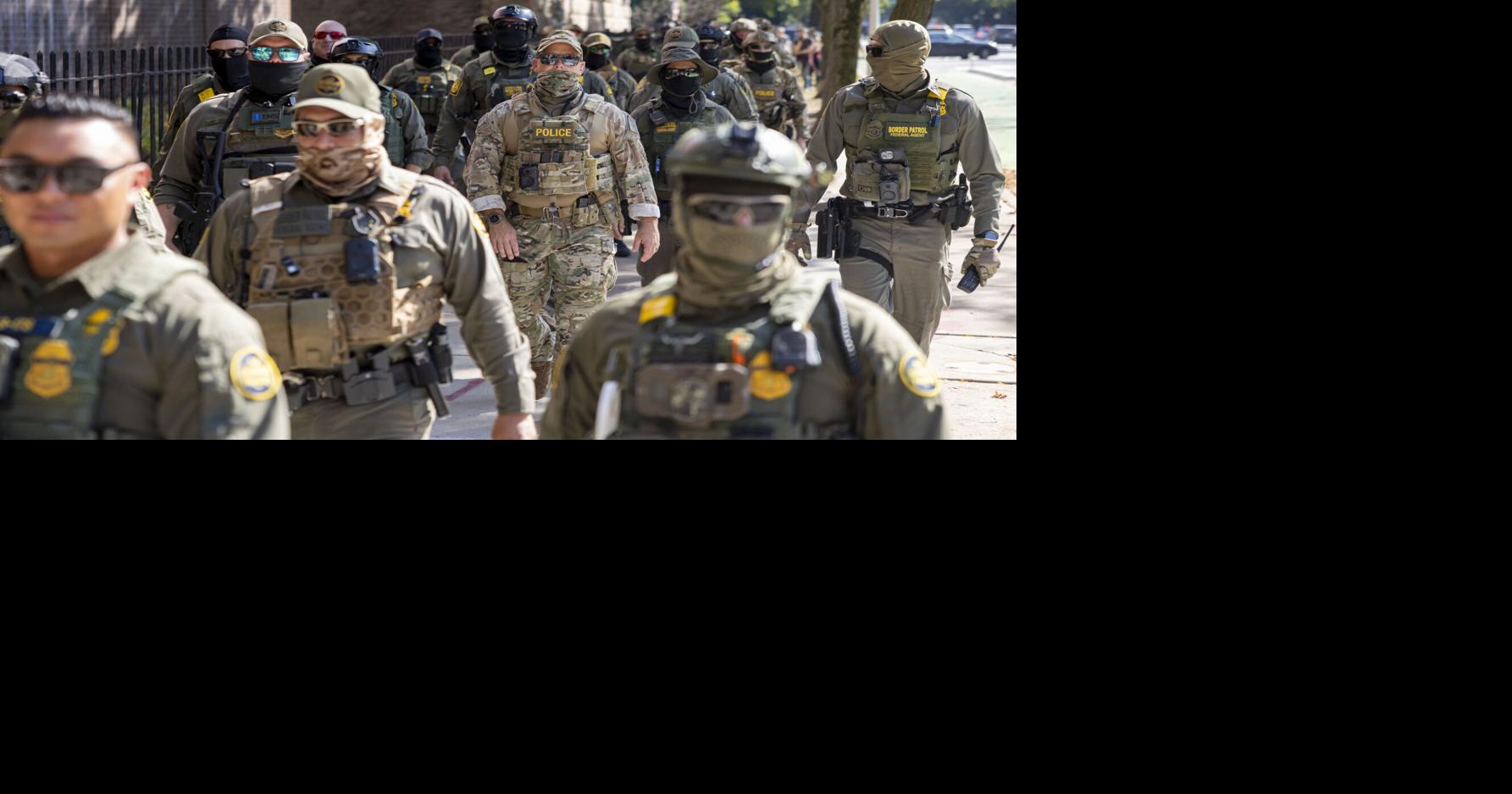 In show of force, dozens of armed federal immigration agents patrol ...