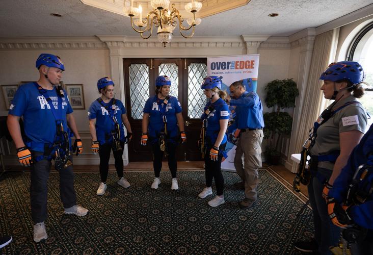 'A great cause': Dozens go Over the Edge in Dubuque fundraiser | Tri ...