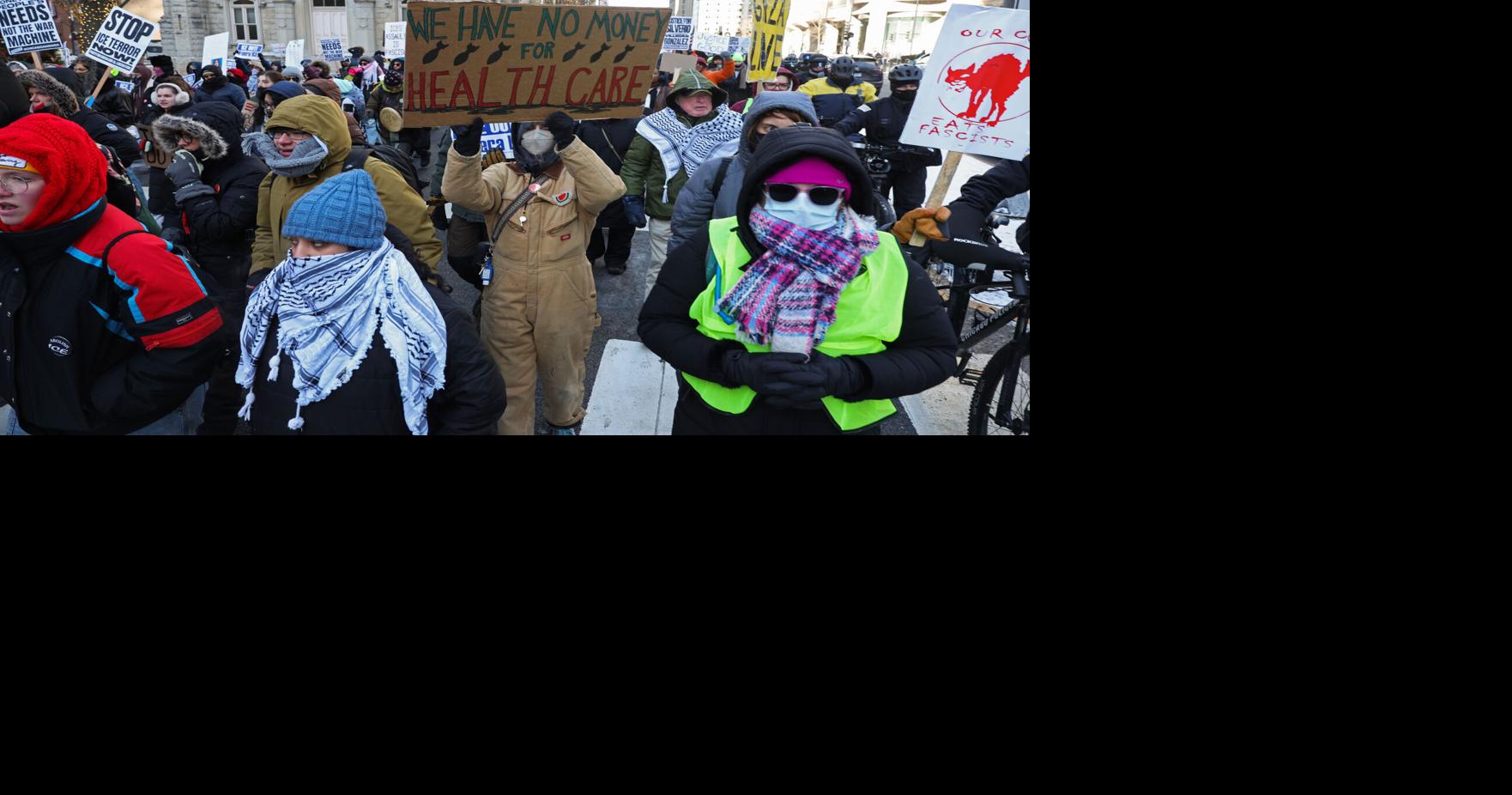 In freezing conditions, hundreds gather in downtown Chicago to protest ...