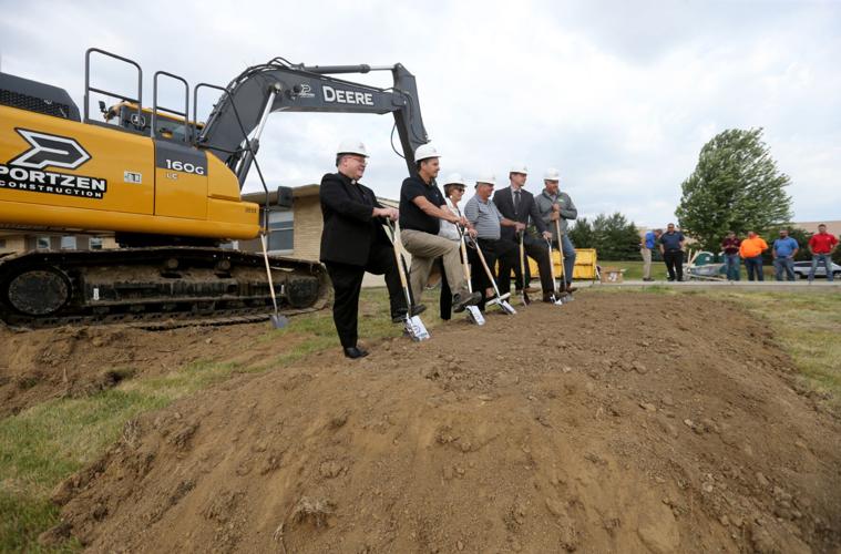 Holy Family, church officials break ground on new Resurrection school ...