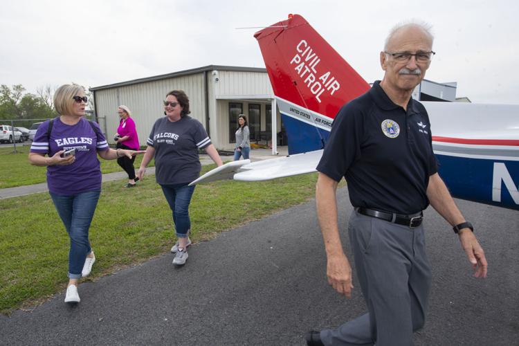 2 STEM teachers fly over schools as cheering students wave from below ...