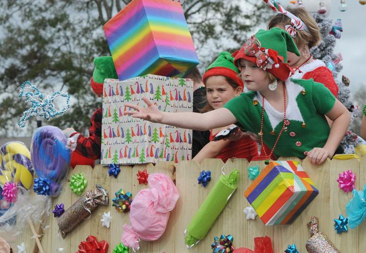 Dark clouds, rain can't stop Walker Christmas parade from rolling ...