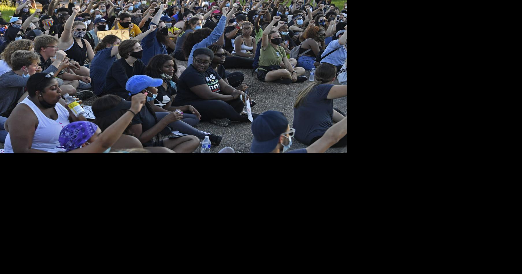Photos: Protesters block access to Raising Cane's before marching to ...