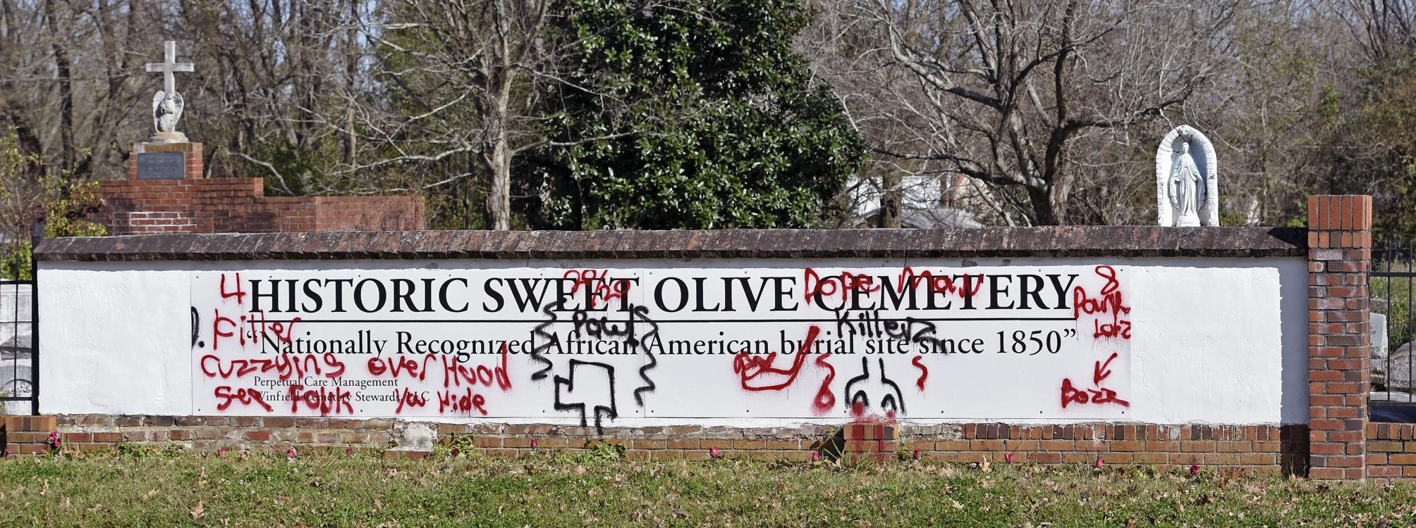 Graffiti covers sign at Baton Rouge's oldest African American cemetery ...