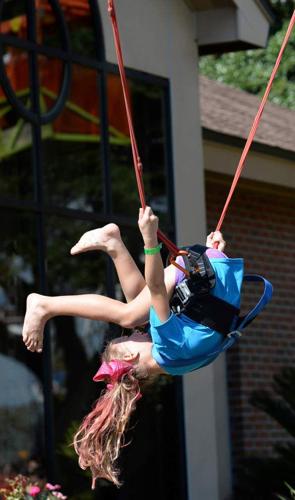 Flying horses, sliding dads, rolling dragons at St. George Fair ...