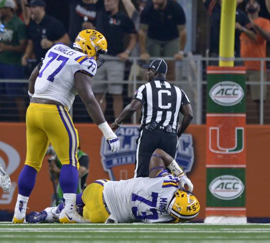 LSU's K'Lavon Chaisson, Adrian Magee leave Miami game injured; Orgeron ...