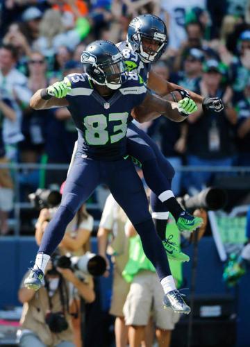 Russell Wilson, Marshawn Lynch help Seattle hold off Broncos 26-20 in ...