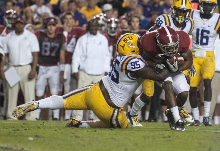 LSU DT Quentin Thomas played with two torn biceps; LT La’el Collins has ...