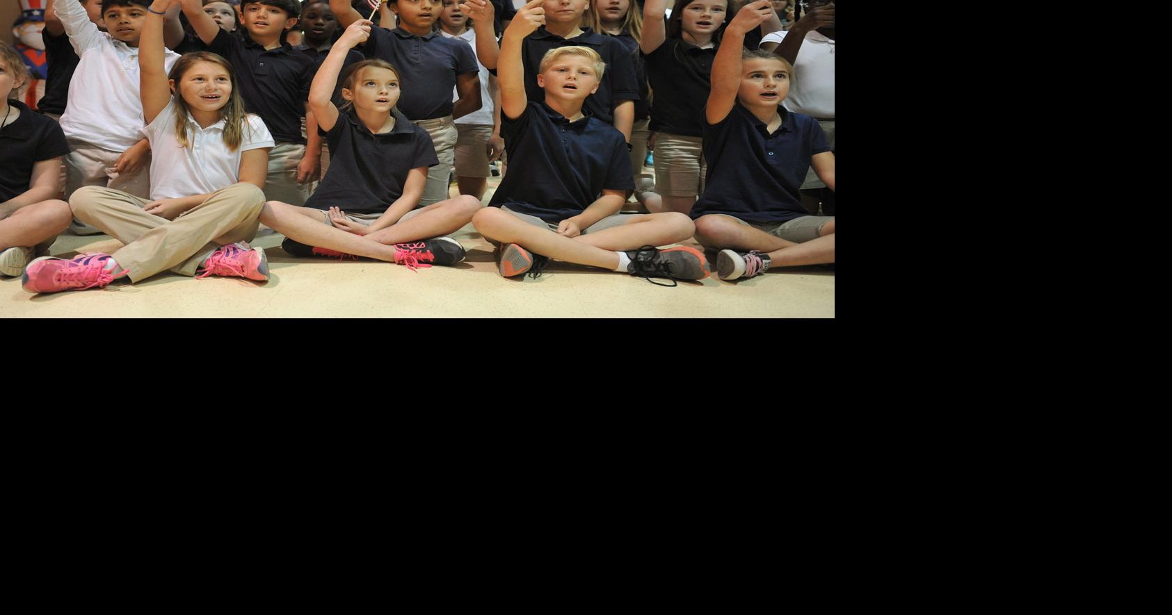 Seventh Ward students honor veterans with song, flags and speeches ...