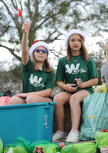 Dark clouds, rain can't stop Walker Christmas parade from rolling ...