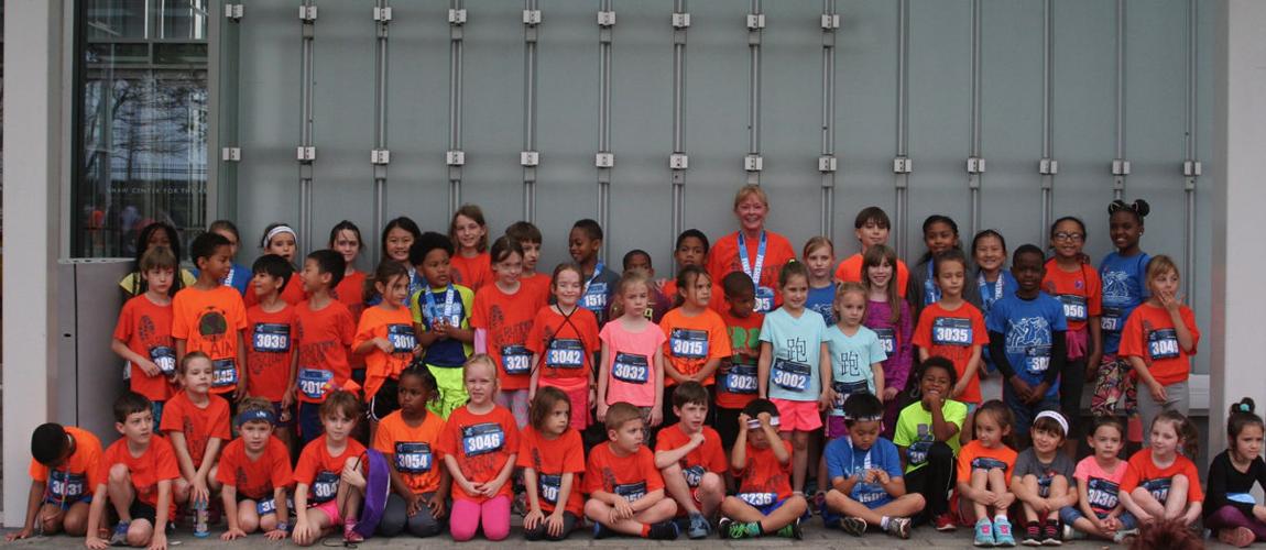 Baton Rouge FLAIM's Run Club ends year with check from mini marathon ...