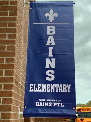 Bains Elementary School PTL purchases inspirational banners for carpool ...