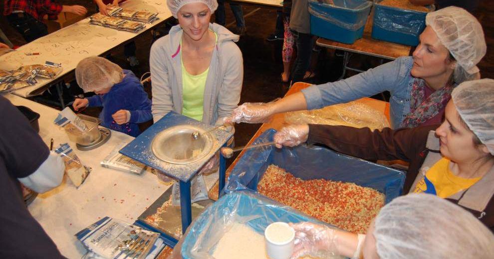 Groups pack food to feed the hungry | News | theadvocate.com