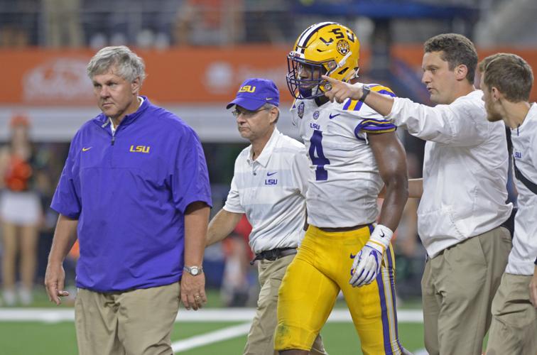 LSU's K'Lavon Chaisson, Adrian Magee leave Miami game injured; Orgeron ...