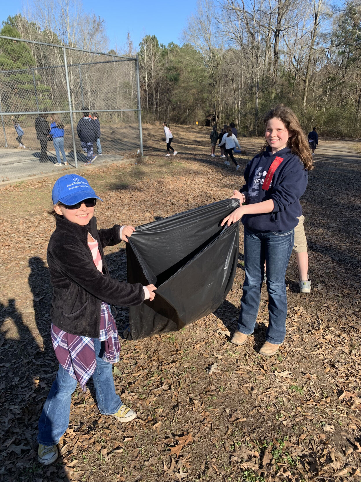 Bains Elementary students use prize recess time to clean up grounds ...