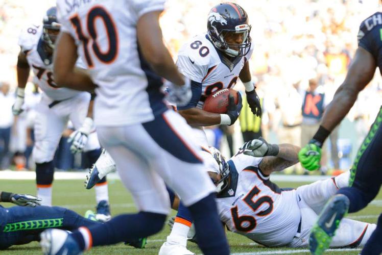Russell Wilson, Marshawn Lynch help Seattle hold off Broncos 26-20 in ...