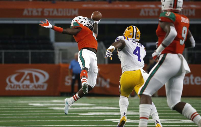 LSU's K'Lavon Chaisson, Adrian Magee leave Miami game injured; Orgeron ...