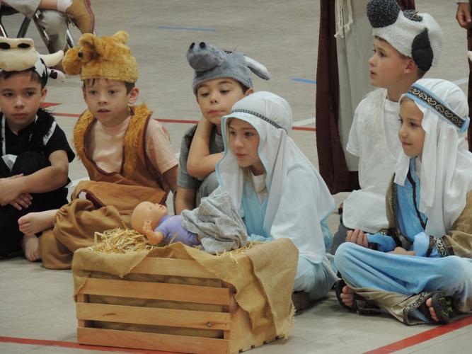 Holy Ghost Catholic School first graders perform Easter parade ...
