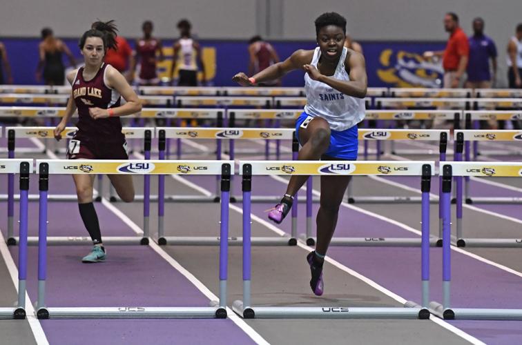 Soaring and scoring: Zachary's Chris Hilton clears 7-0 in high jump ...