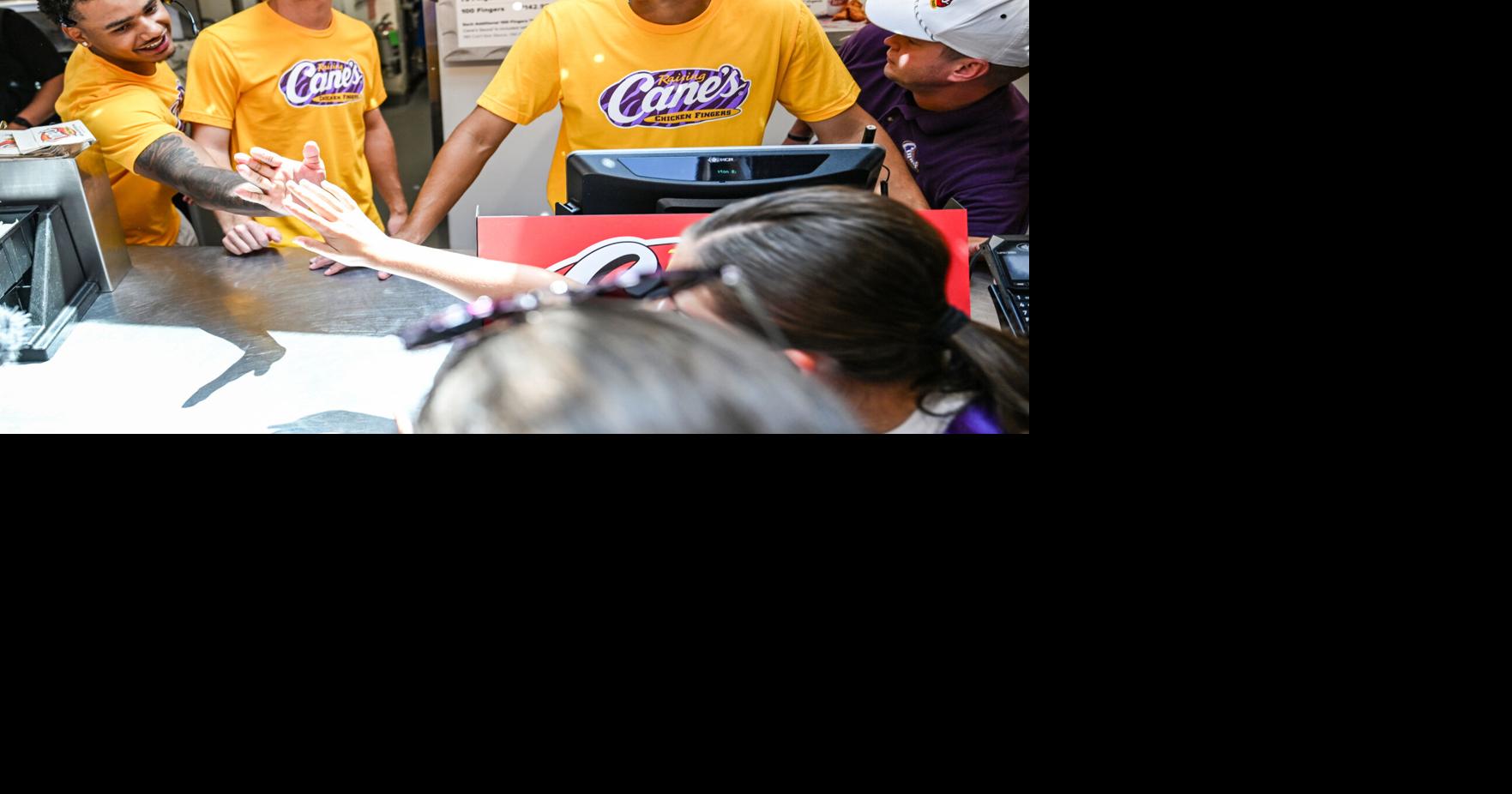 Photos: LSU College World Series winners work a shift at Raising Cane's ...
