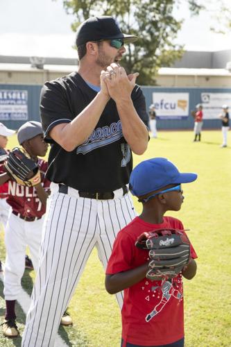 Play ball. Young players pick up tips at summer youth baseball camp ...