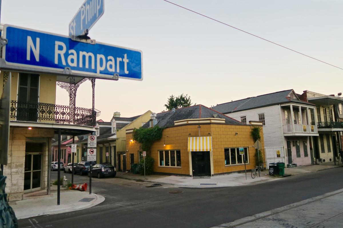 As streetcars roll on Rampart Street, lifting the barriers, raising a ...