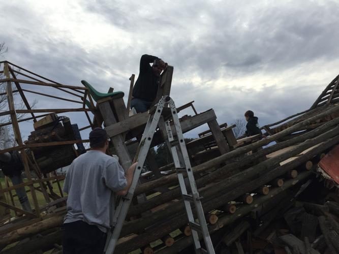 Family pays tribute to Cajun Navy with 27-foot bonfire structure ...