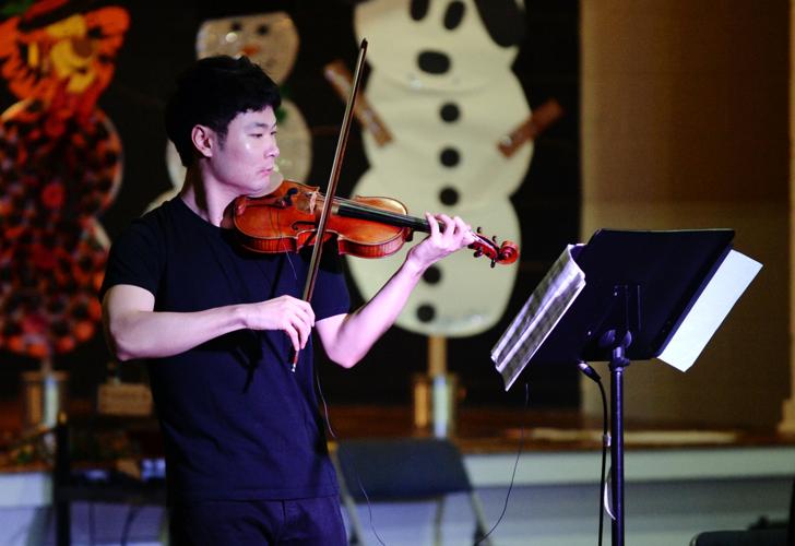 Photos: Composer Eric Genuis performs and speaks at Truman Early ...