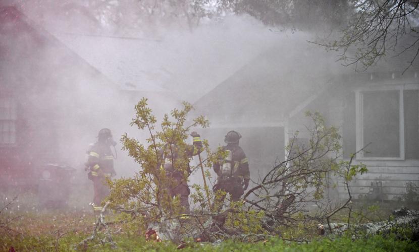 House catches fire from downed power line caused by heavy winds, fire ...