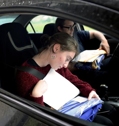 Live Oak seniors pick up caps, gowns during drive-thru distribution ...