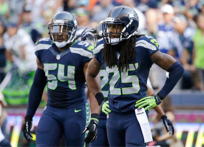 Russell Wilson, Marshawn Lynch help Seattle hold off Broncos 26-20 in ...