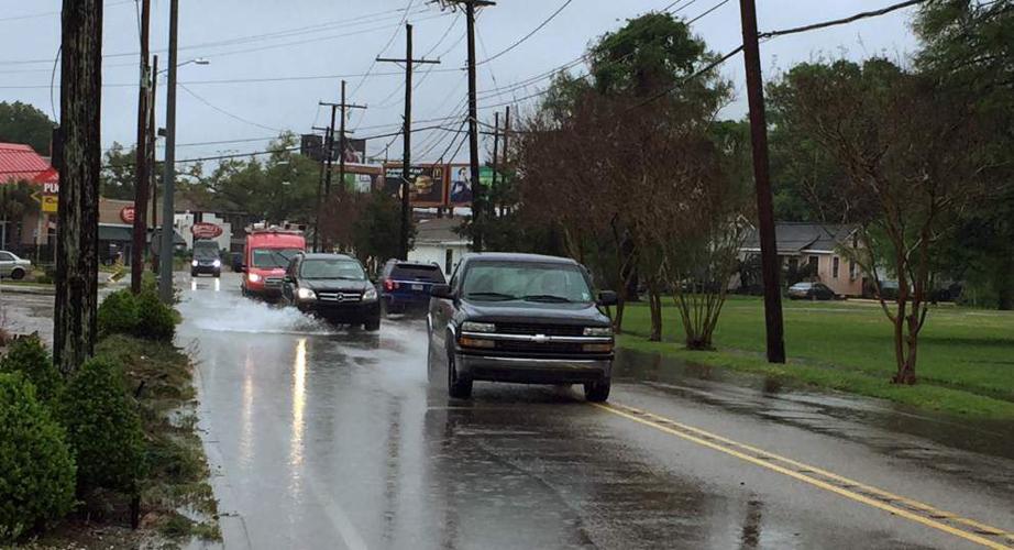 Flooded streets and floating garbage cans: Photos of Friday's soggy ...