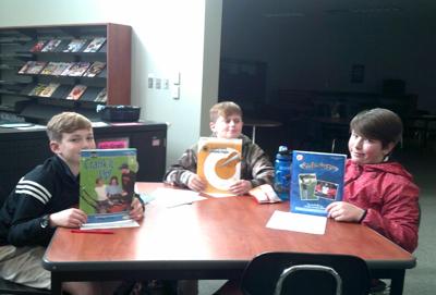 North Corbin Junior High School 4-H members work on project books ...
