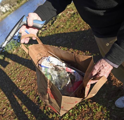 With his litter stick in hand, this 84 year old has cleaned up ...