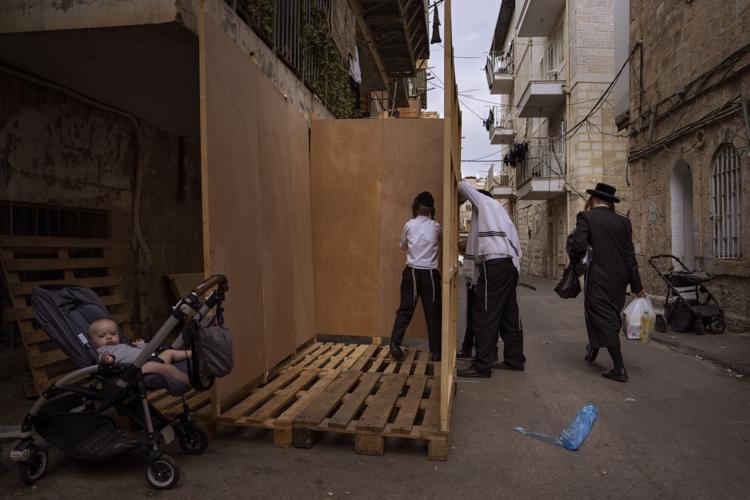 Jewish holiday Sukkot emphasizes building hut with symbols ...
