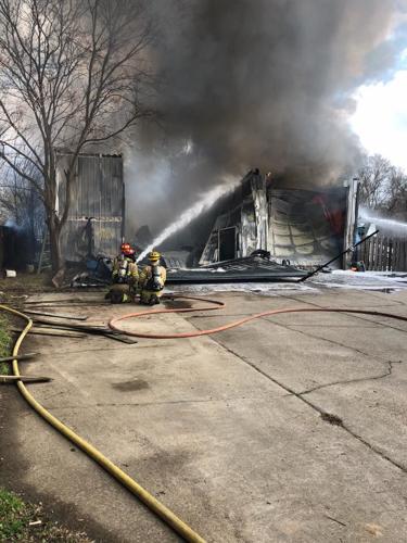 Civilians help rescue firefighter after overhang roof collapses ...
