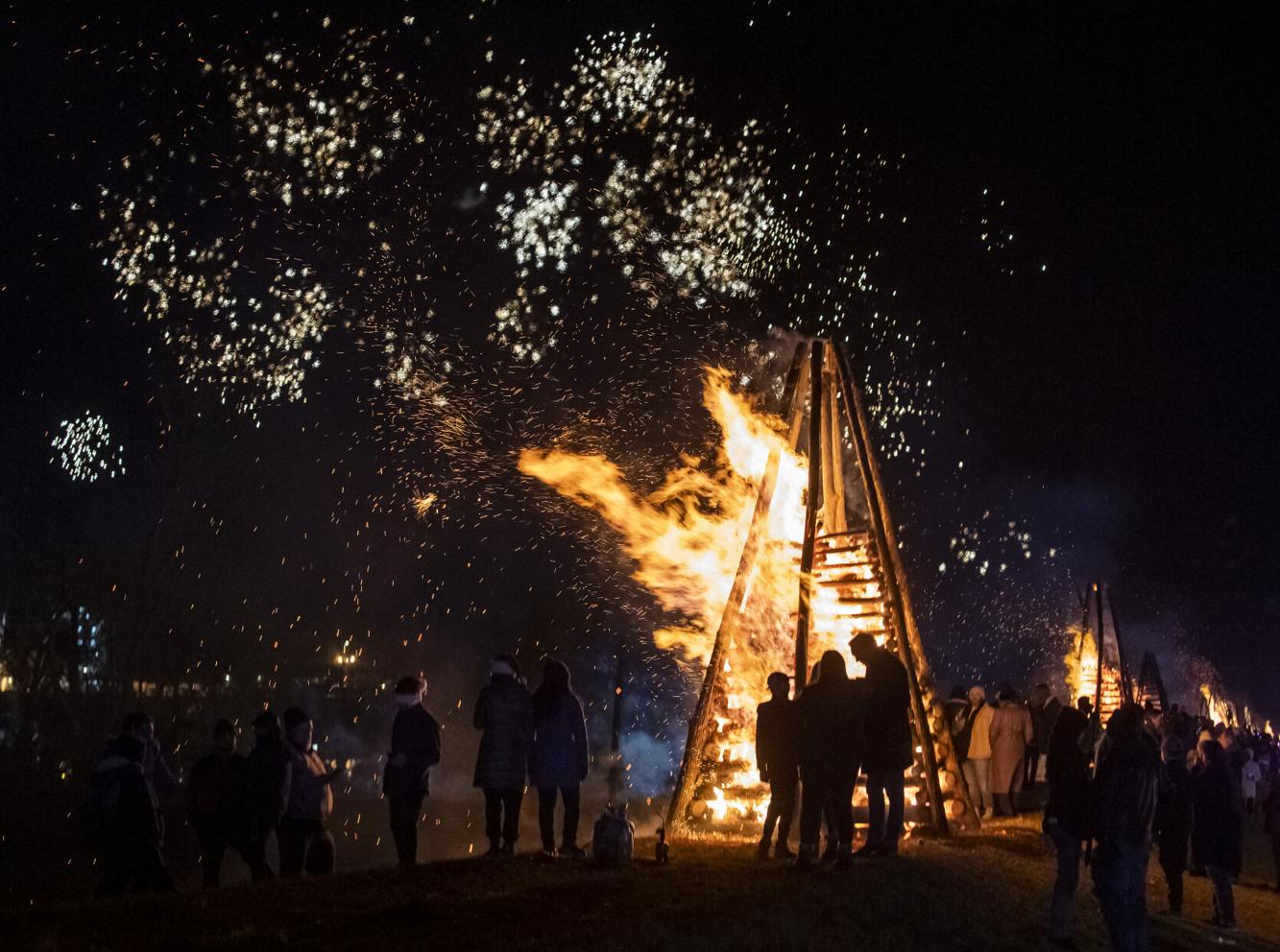 Photos: Christmas Eve Bonfires light the way for Papa Noel | Baton ...