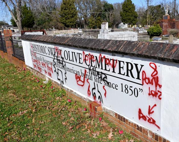 Graffiti covers sign at Baton Rouge's oldest African American cemetery ...