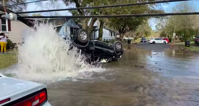 Video: Busted fire hydrant floods street after car crashed, flipped on ...