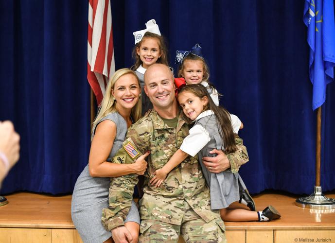 The home front: Major surprises young daughters after return from Iraq ...
