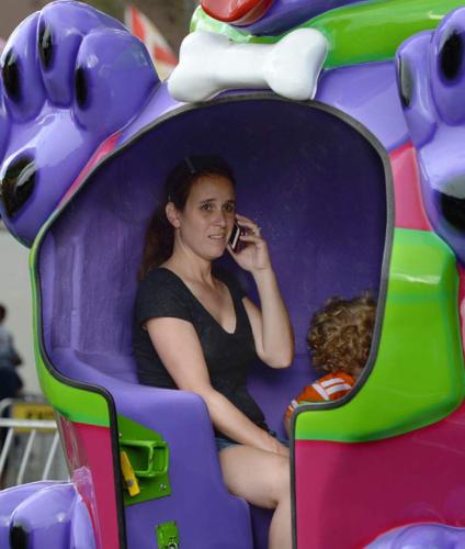 Flying horses, sliding dads, rolling dragons at St. George Fair ...