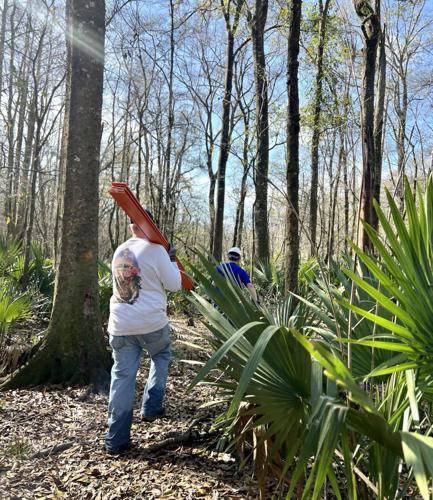 Rotary Club of Greater Ascension erects trail markers at Amite River ...