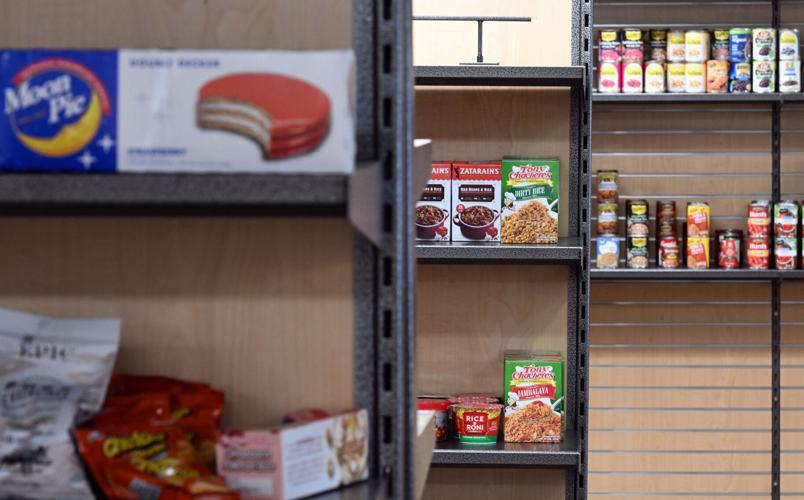 UL food pantry, clothing outlet stocks shelves, racks to serve students ...