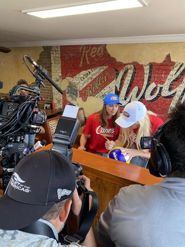 Louisiana Olympic duo works a shift at Cane's in Baton Rouge | News ...